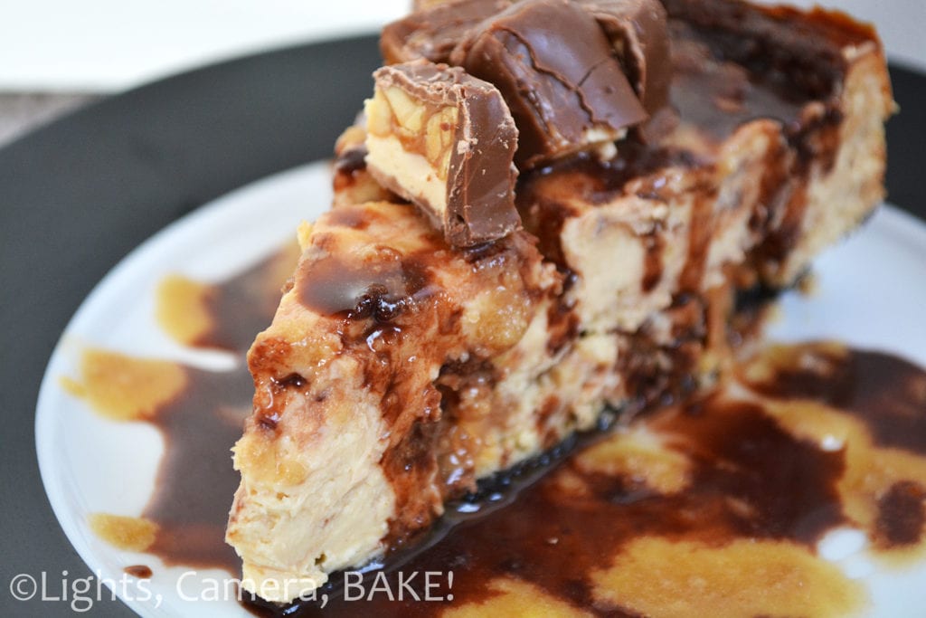 Baked Snickers Cheesecake (Video) - Lights, Camera, BAKE!